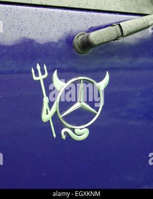 Mercedes Benz car badge as as Devil Stock Photo - Alamy