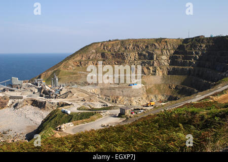 Ronez Quarry in summer sunshine on Jersey's north coast with clear blue ...