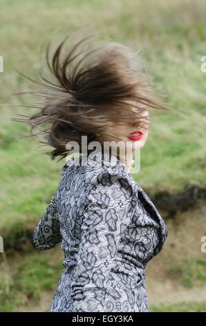 Scared young woman running away in the dark looking over shoulder Stock ...