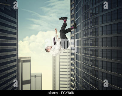 skyscaper background and falling business man Stock Photo - Alamy