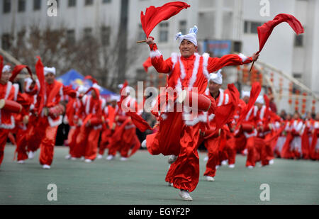 Yan'an. 4th Mar, 2015. Dancers perform waist drum dance during a parade ...