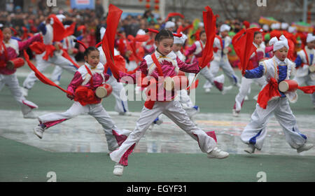 Yan'an. 4th Mar, 2015. Children perform waist drum dance during a ...