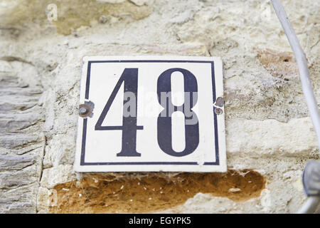 enameled house number forty two. Black lettering on a white background ...