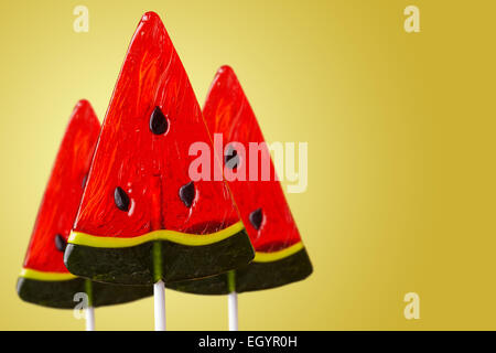 lollipop in the form of a watermelon on a purple background Stock Photo ...