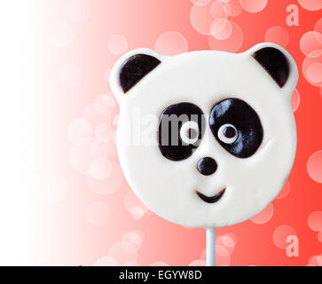 lollipop in the form of an panda on a pink background Stock Photo - Alamy