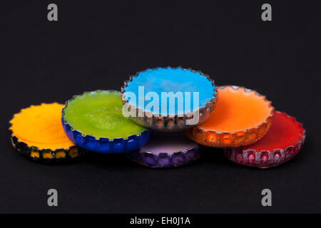 Skully bottle caps filled with melted crayons and setup for the game of ...