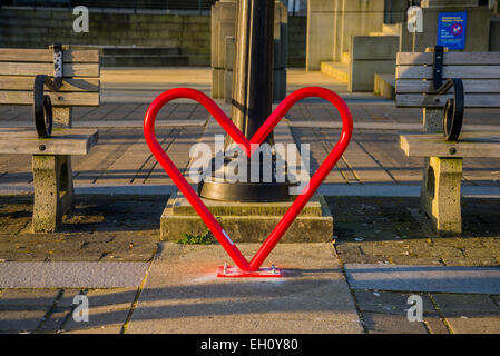 Heart-shaped bicycle rack Stock Photo - Alamy