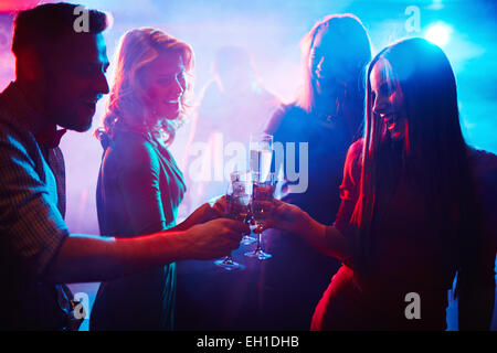 Friends drinking alcohol at New Year party Stock Photo - Alamy