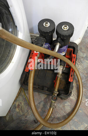 Flushing out a central heating system to remove particles and sludge ...