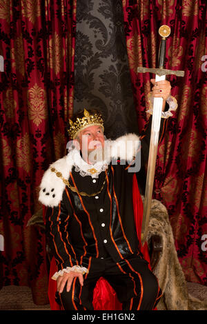 Man king sitting on the throne beside the Queen is a woman. Man is ...