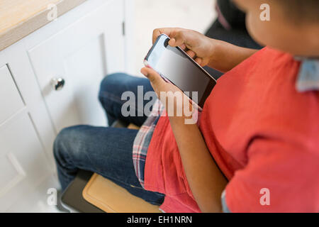 Boy (7-9) playing games on cell phone Stock Photo: 82375737 - Alamy