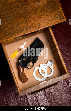 38 Revolver in Desk Drawer with Handcuffs Stock Photo - Alamy
