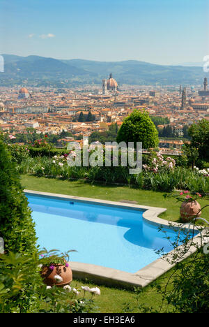 Swimmingpool in a garden with magnificent view over city of Florence ...