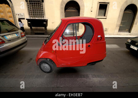 Small red one-person (three wheeler) electric Pasquali Riscio car ...