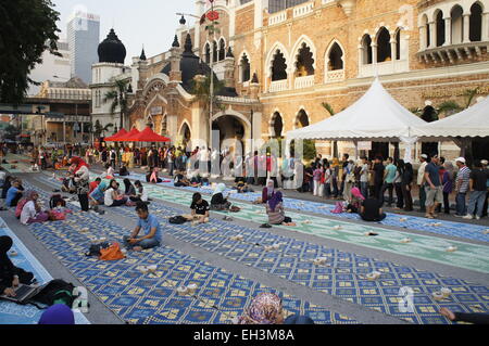 Muslims eat to break their fast during the Muslim holy fasting month of ...
