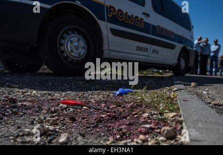 Blood stains are seen at the site after a car explosion near the ...