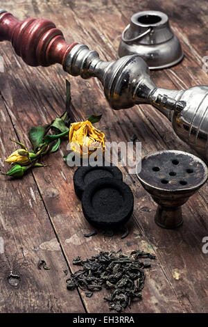details Shisha and accessories on wooden background.image is tinted in ...
