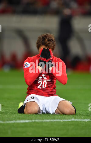 Lee Tadanari of the Urawa Red Diamonds argues a penalty call by referee ...