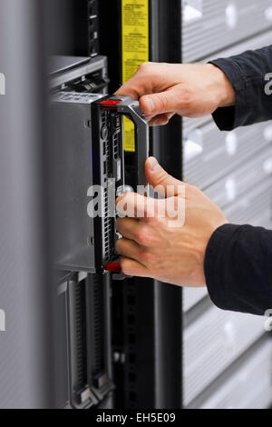 Install or remove a blade server in a blade chassis in a rack. Shot ...