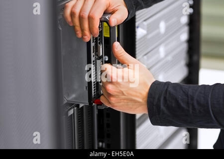 Install or remove a blade server in a blade chassis in a rack. Shot in ...