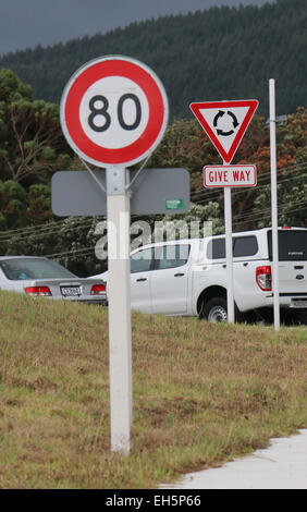 Give way yield Road sign New Zealand round-a-bout Stock Photo - Alamy