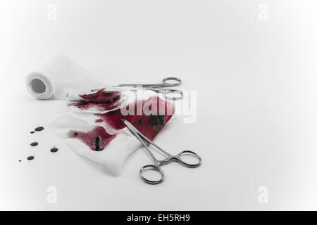 Surgical composition with bullet, blood and bandage Stock Photo - Alamy