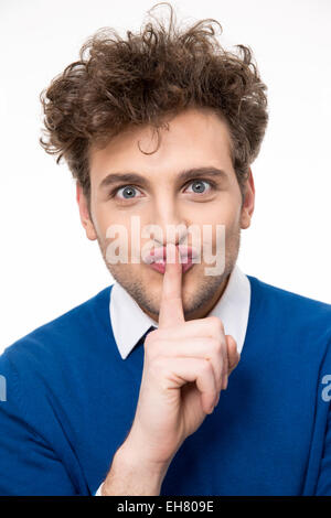 Businessman making a shh hand sign gesture, be quiet and keep the ...