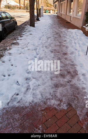 Snow and ice covered sidewalk - USA Stock Photo - Alamy