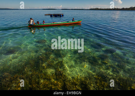 Indonesia, Maluku, Seram Island, Family sitting together. (Large format ...