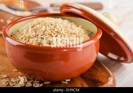 Brown Rice in a Wood Bowl on White Stock Photo - Alamy