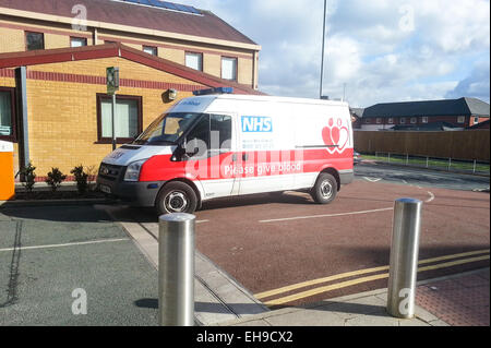 NHS Blood Donor van driving along town centre road supporting ...