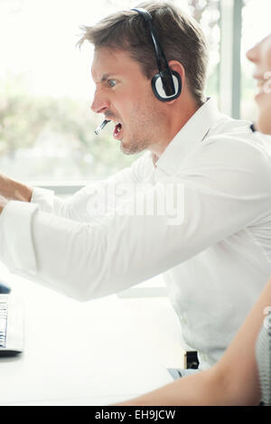 Frustrated call centre operator Stock Photo - Alamy