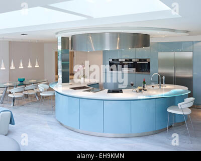Blue and white curved breakfast bar/island in modern kitchen of ...