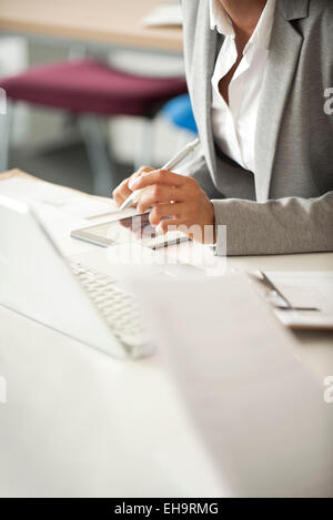 cropped view of woman taking on knitted socks at morning Stock Photo ...