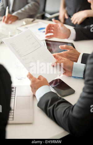 Business meeting with digital tablets, smartphone and laptop on table ...