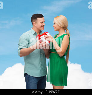 white gift box with blue bow in shoping cart isolated on white Stock ...