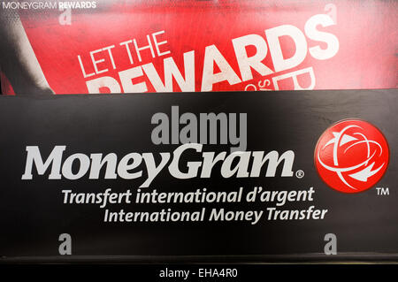 A MoneyGram logo shown at the post office in Englishtown, N.S Stock ...