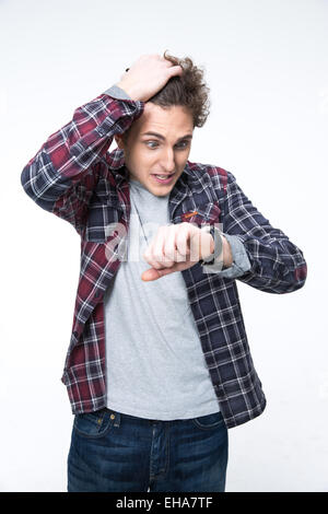 Young caucasian student man over grey grunge wall wearing headphones ...