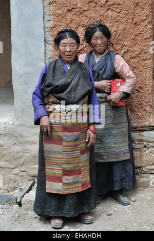 Two Tibetan women wearing their traditional bangdian or pangden aprons ...