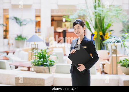 Japanese female hotel concierge Stock Photo - Alamy