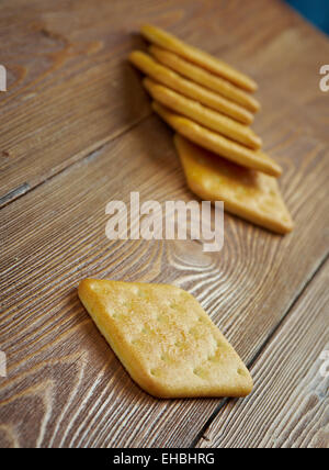 saltine crackers on a wood table surface - top view Stock Photo - Alamy