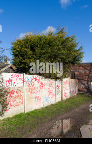 Graffiti Daubed on a Concrete Fence, UK Stock Photo - Alamy