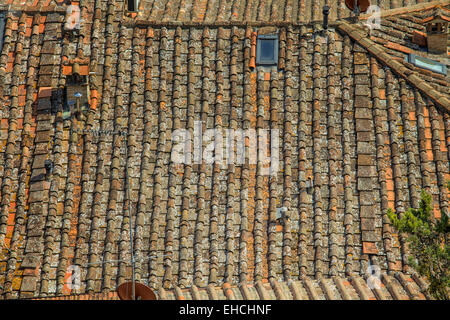 Roof shingles. Red roof shingles. Italy Stock Photo - Alamy