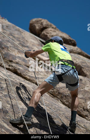 Clamber on cliff Stock Photo - Alamy