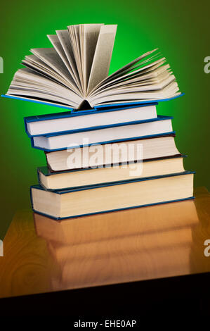 Stack of books against gradient background Stock Photo - Alamy