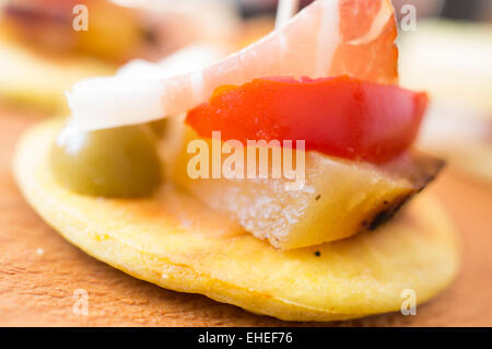 Tapas with bacon and potatoes, olives and tomatoes Stock Photo - Alamy