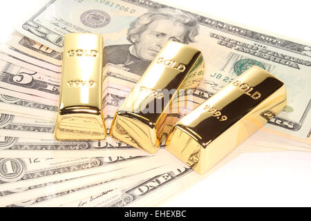 Gold bars with dollar banknotes on paper background Stock Photo - Alamy