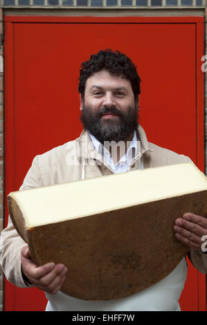 Man holding cheese at Mons Cheesemongers London Stock Photo - Alamy