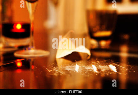 Taking Cocaine at a dinner party London Stock Photo - Alamy