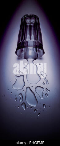 Spilt or spilled water from a drinking glass, scanned from a 10x8 ...